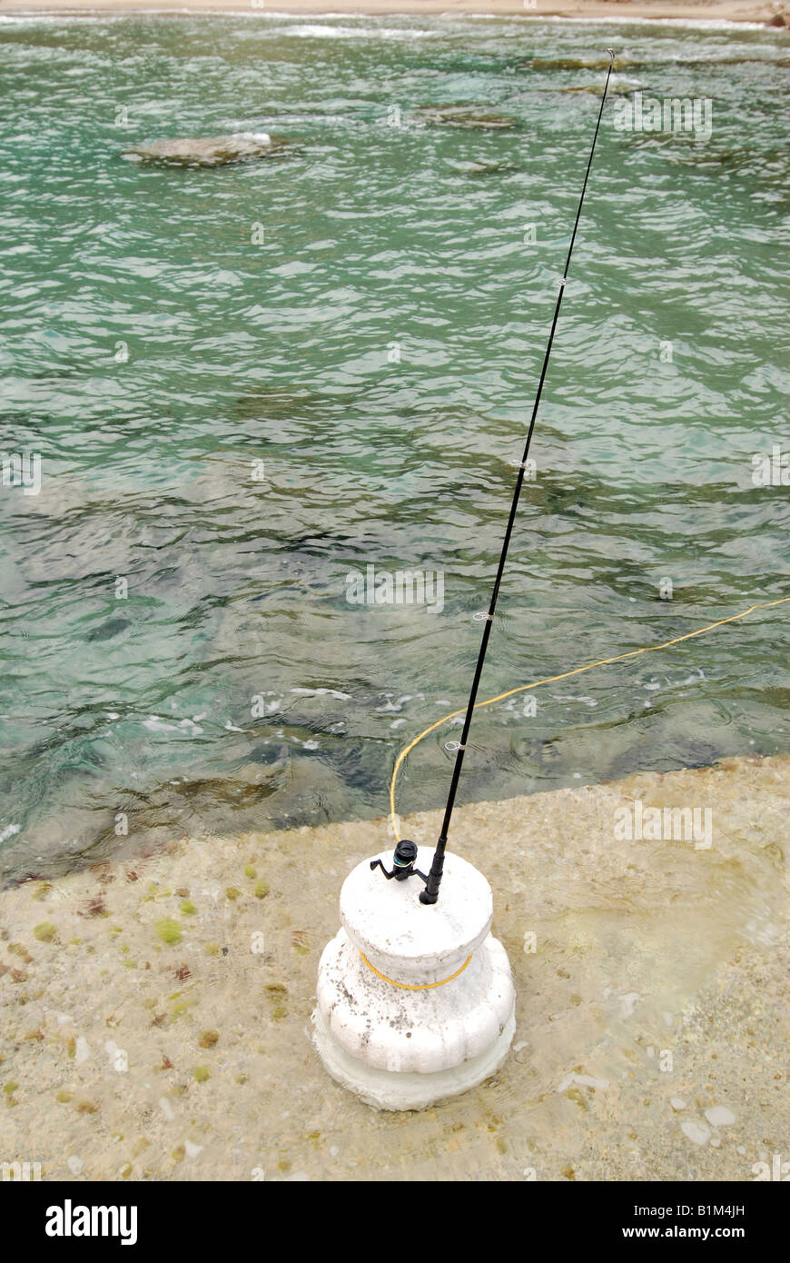 Fishing-rod on Ionian Sea shore near Sinarades town, greek island of ...
