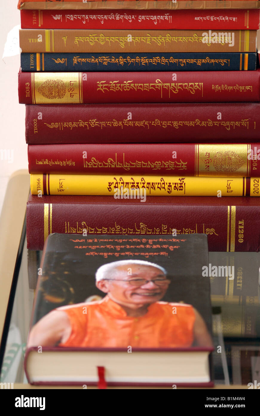 Pile of Tibetan language books Stock Photo - Alamy
