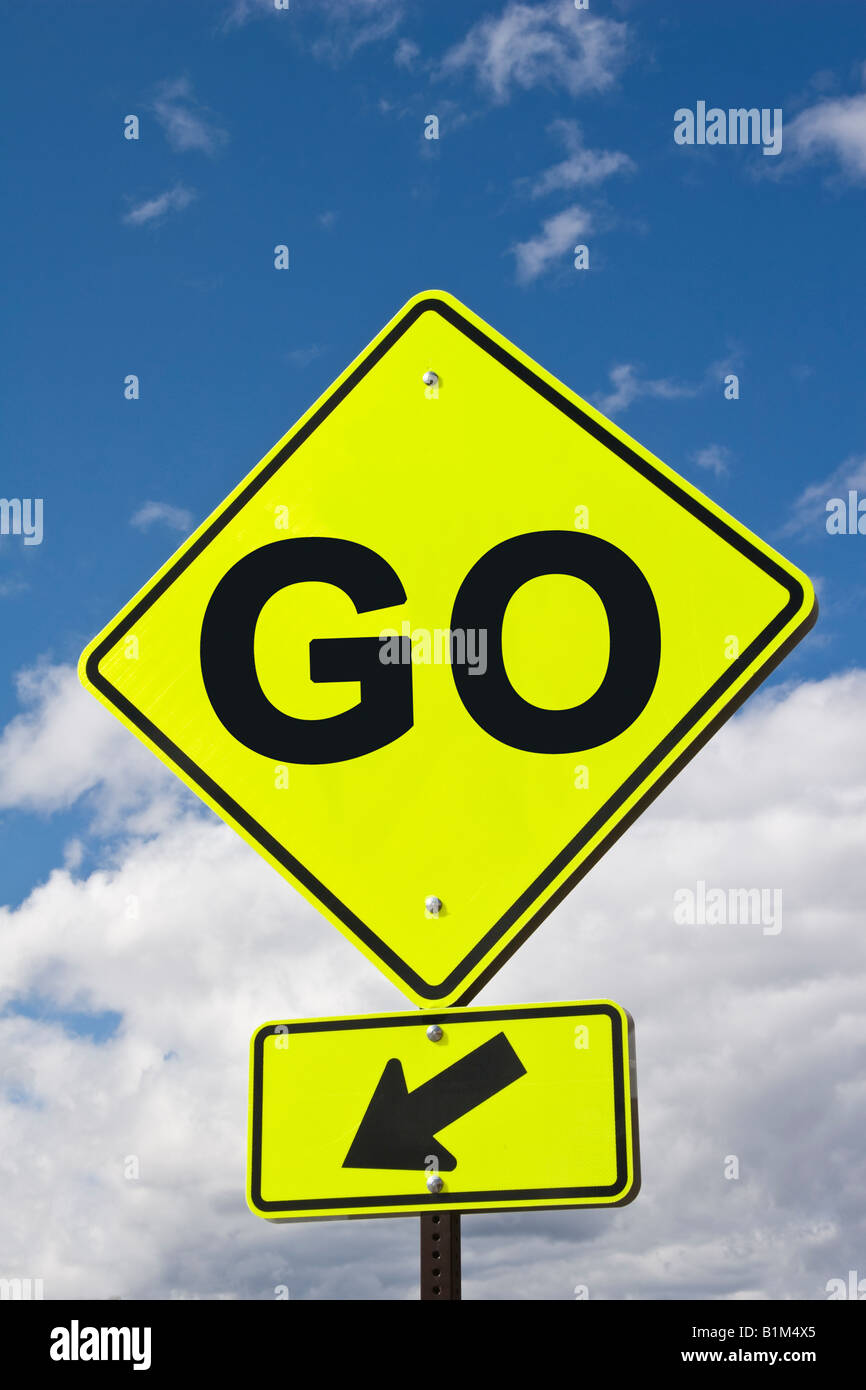 Sign GO on a yellow road sign and blue sky Stock Photo - Alamy
