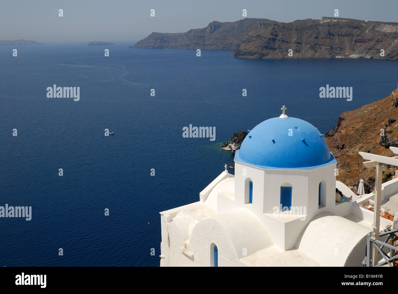 Traditional church with blue cupola in Oia, Santorini, Greece Stock ...