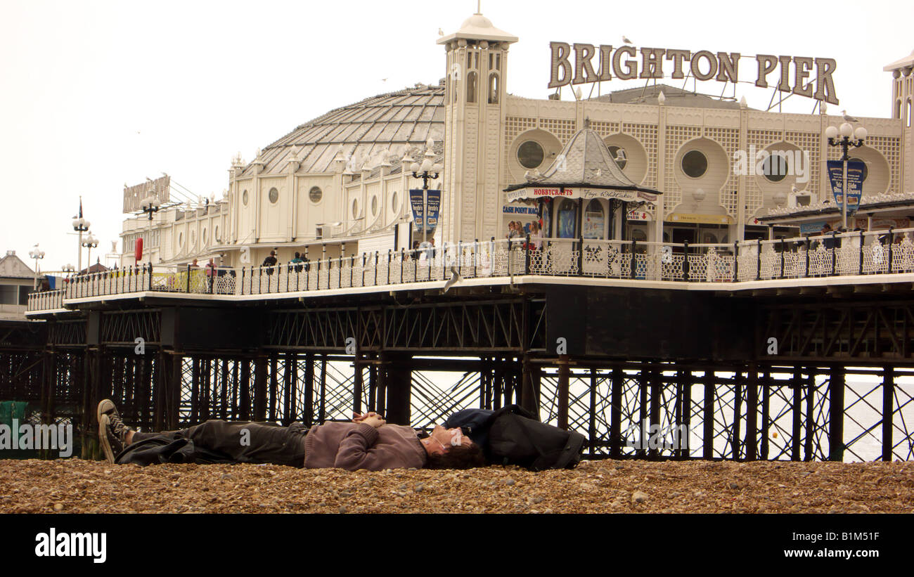 Homeless Man Sleeping On Beach High Resolution Stock Photography and ...