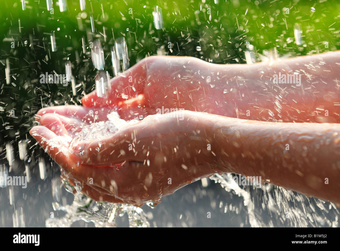 Hands catching clean falling water close up Environmental concept Stock ...