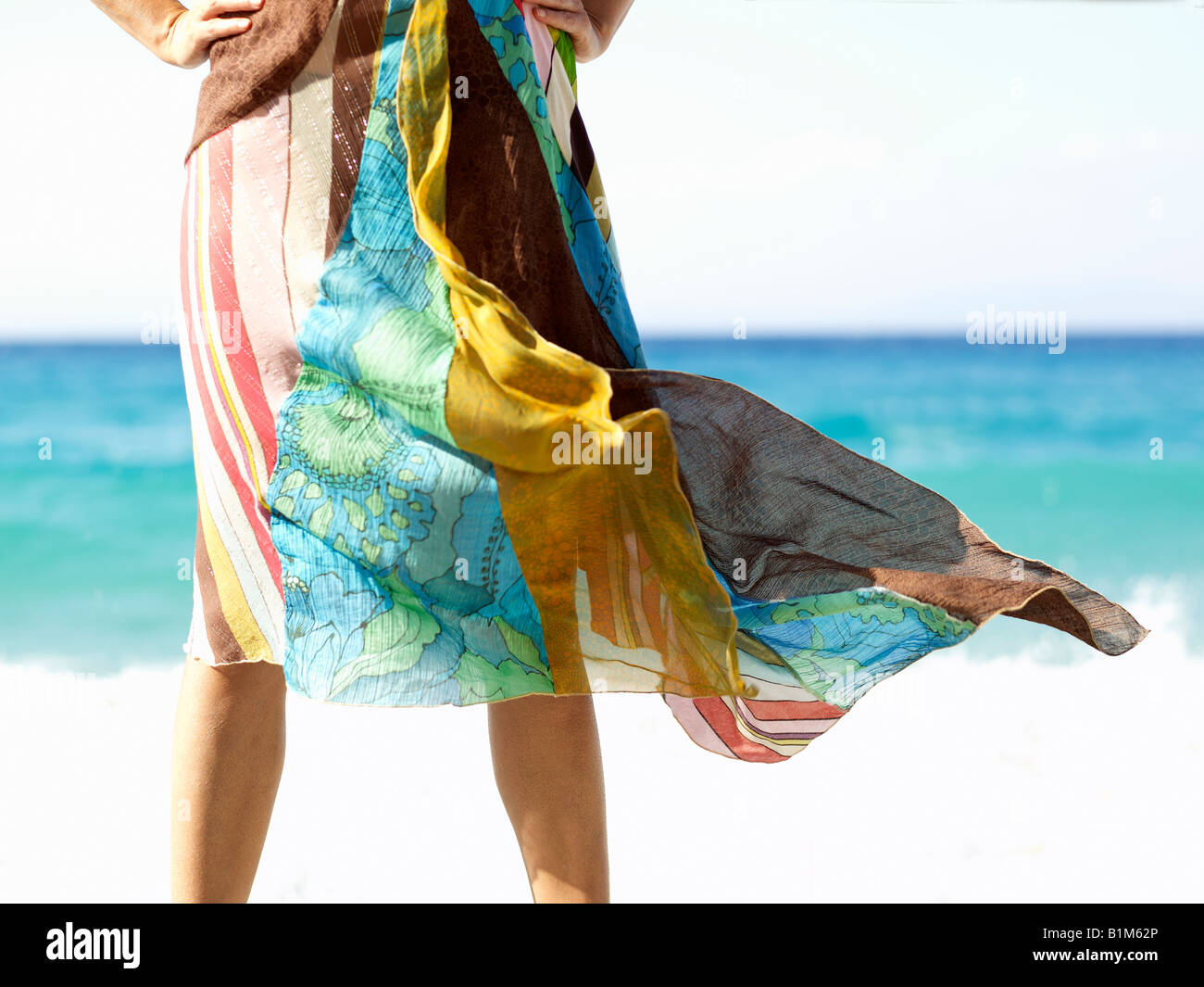 Coloured sun-frock blowing in the wind Stock Photo - Alamy