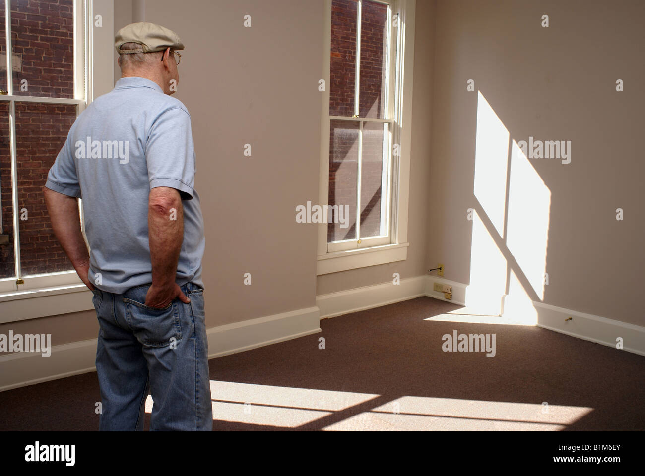 Alone in Empty Room Stock Photo - Alamy