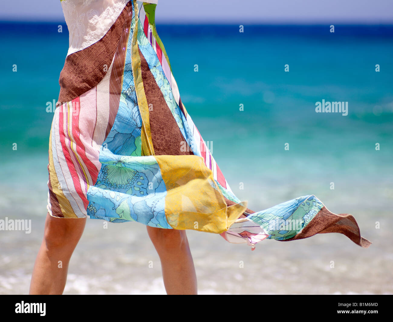 Coloured sun-frock blowing in the wind Stock Photo - Alamy