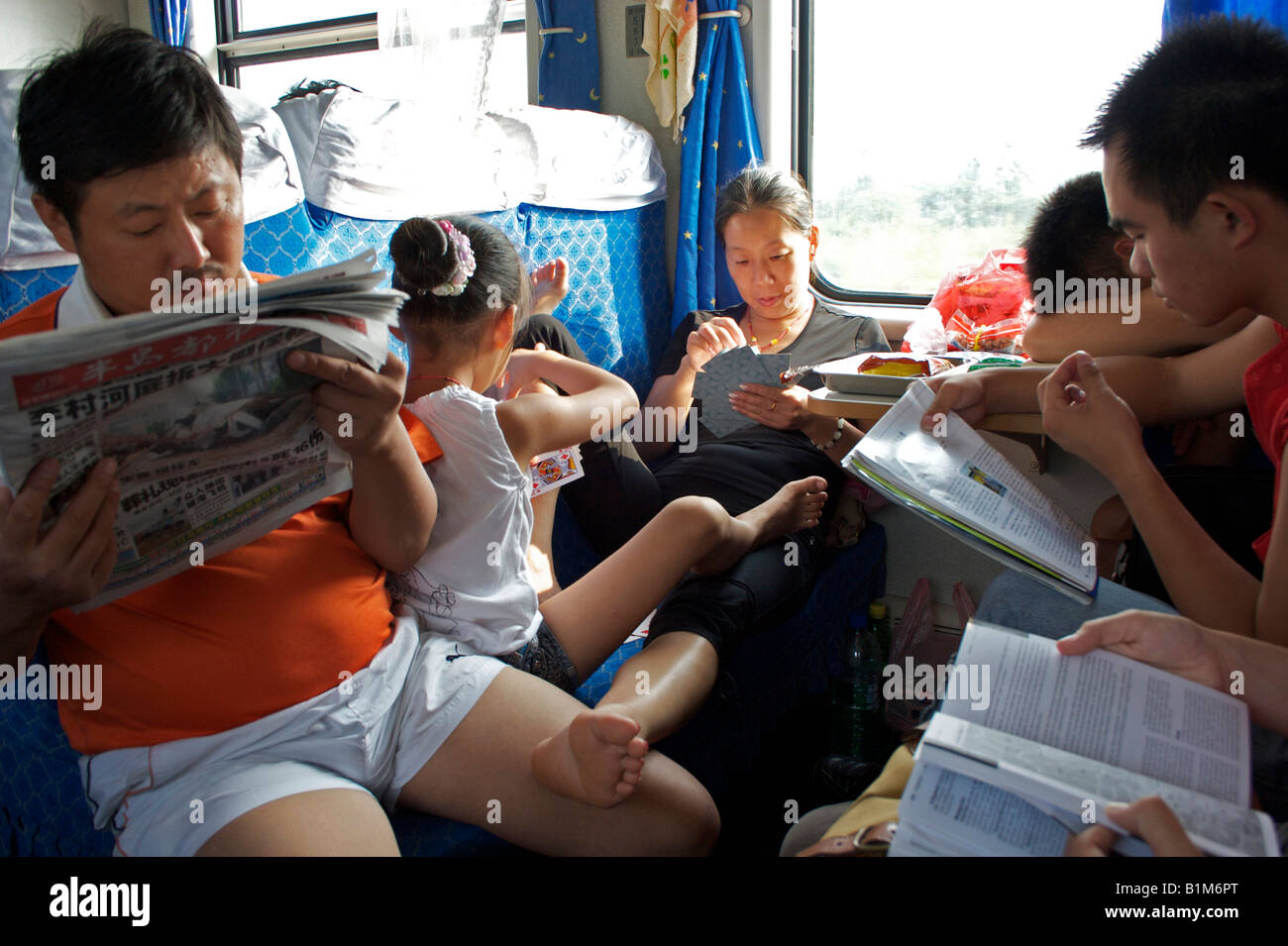 Passengers on a hard seat train from Qingdao to Shanghai China Stock ...