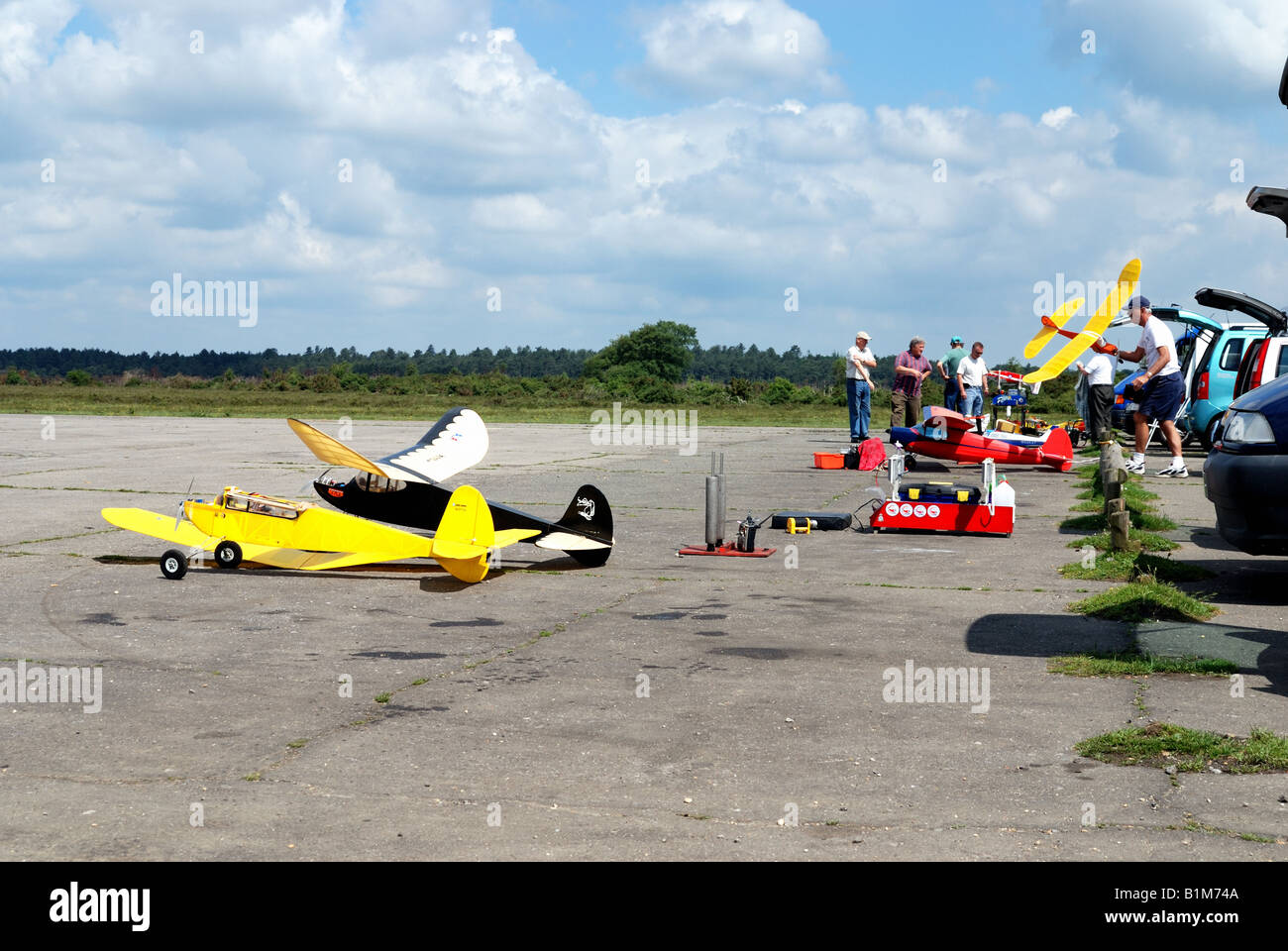 Model airplanes flying on disused airfield Stock Photo - Alamy