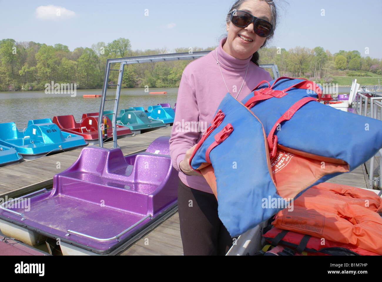 Woman Holding Life Jacket Stock Photo - Alamy