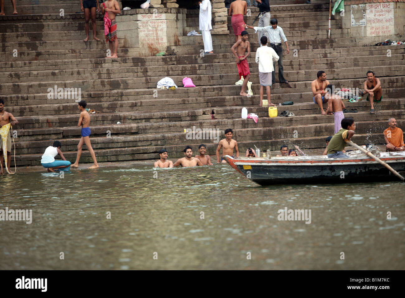 Early morning ablutions on the banks of the Ganges at Varanasi Uttar ...