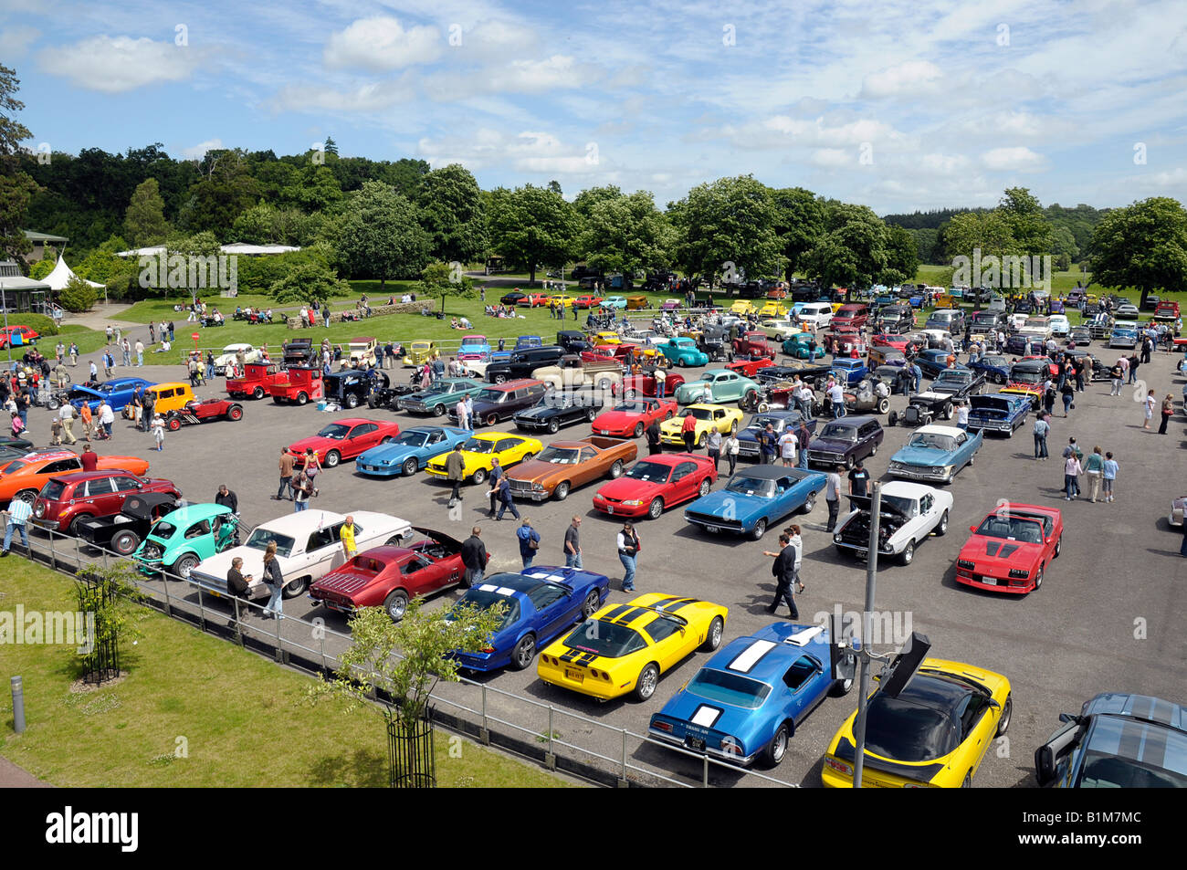 A high view over cars assembled at a custom car show in the New Forest ...