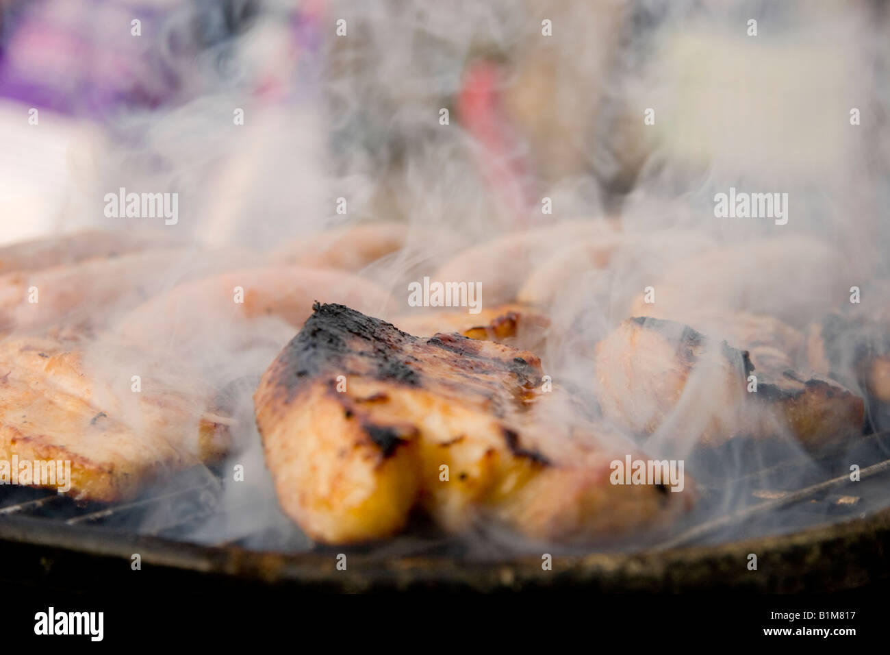 Meat cooking on a smoking barbecue Stock Photo - Alamy