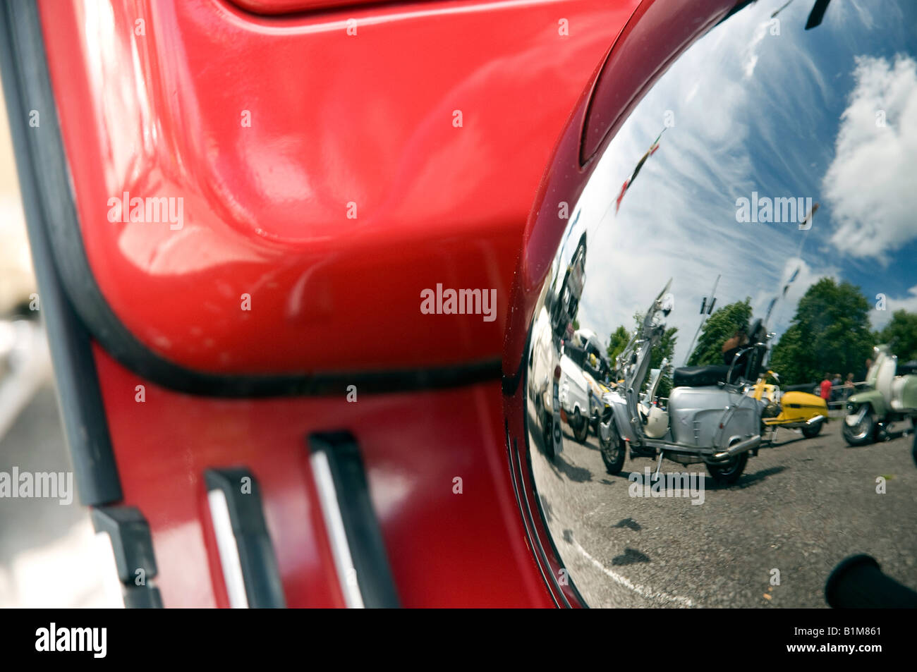 reflection of scooters in a crash helmet placed on the floor of a ...