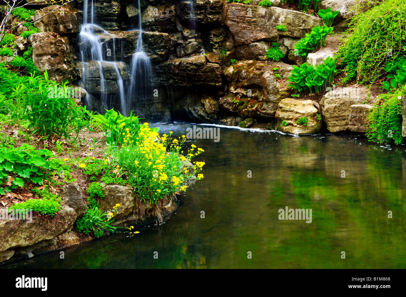 Cascading waterfall and pond in japanese garden Stock Photo - Alamy