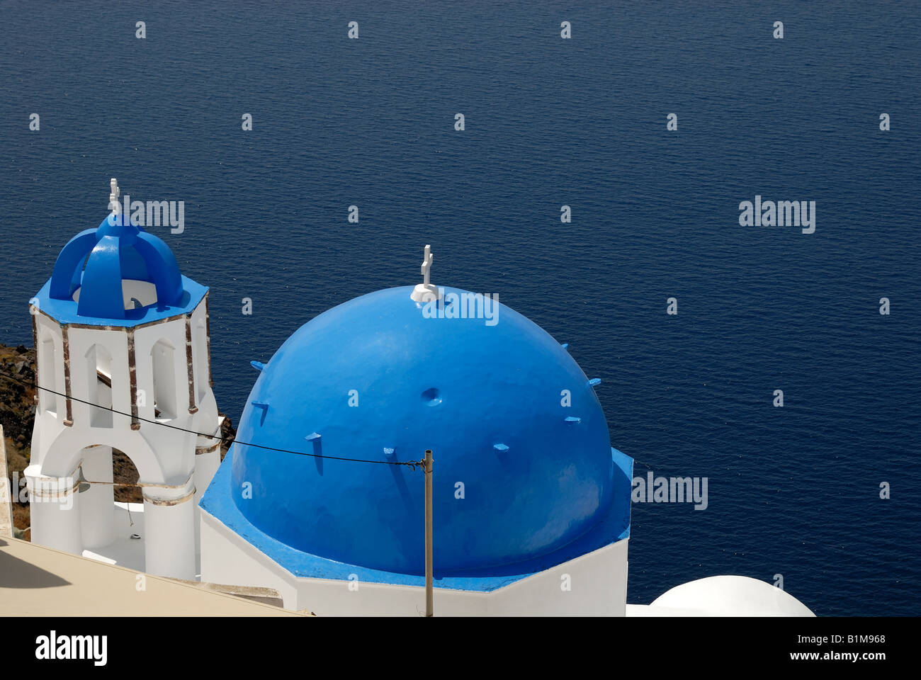 Greek church with blue cupola in Santorini, Greece Stock Photo - Alamy