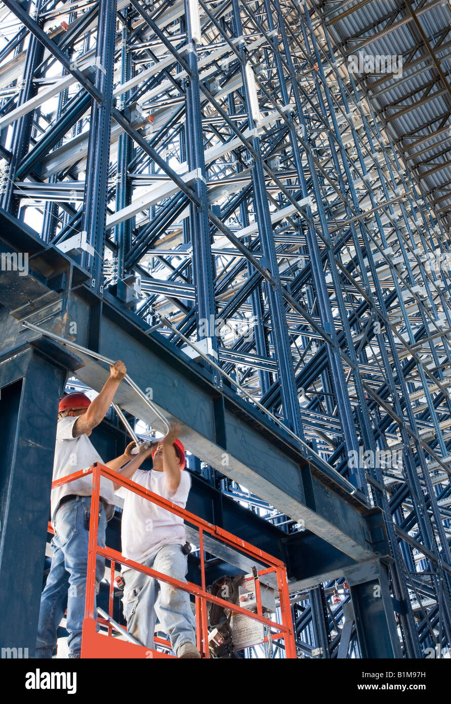 Two construction workers on a commercial construction site Stock Photo ...