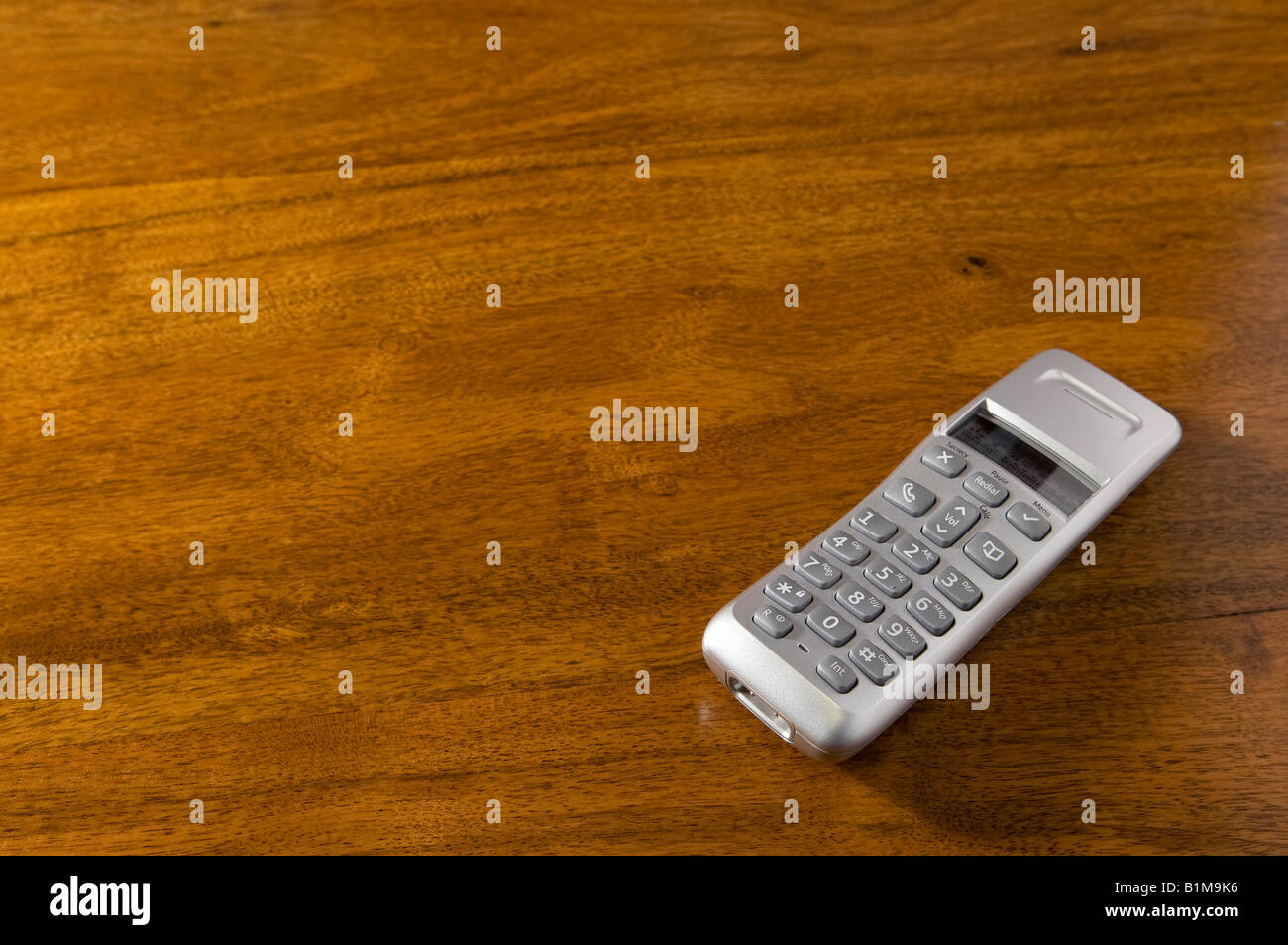 cordless mobile telephone on dining room table Stock Photo - Alamy