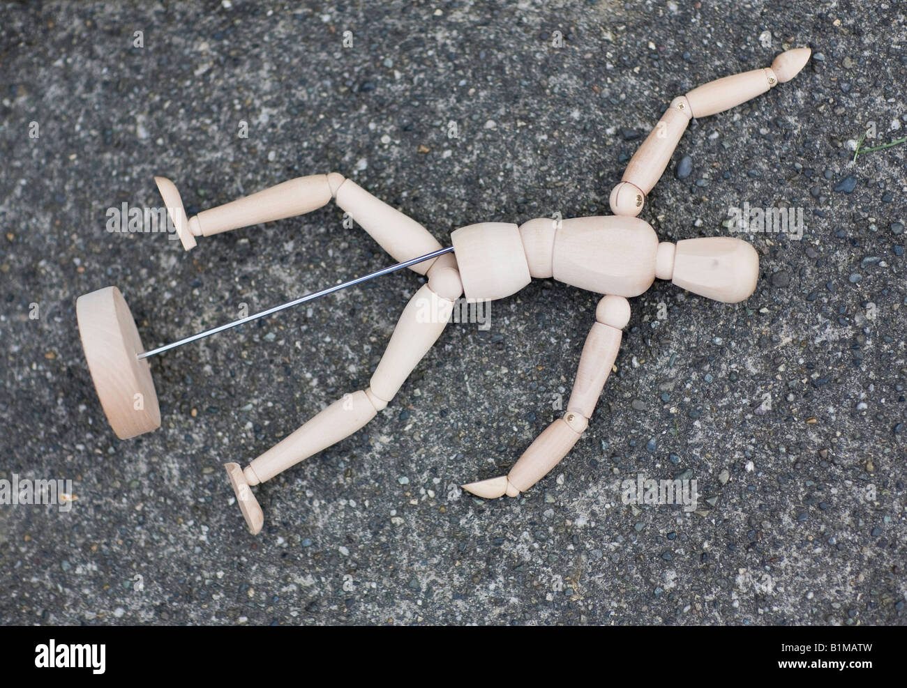 A Fallen Drawing Figurine in the Street Stock Photo - Alamy