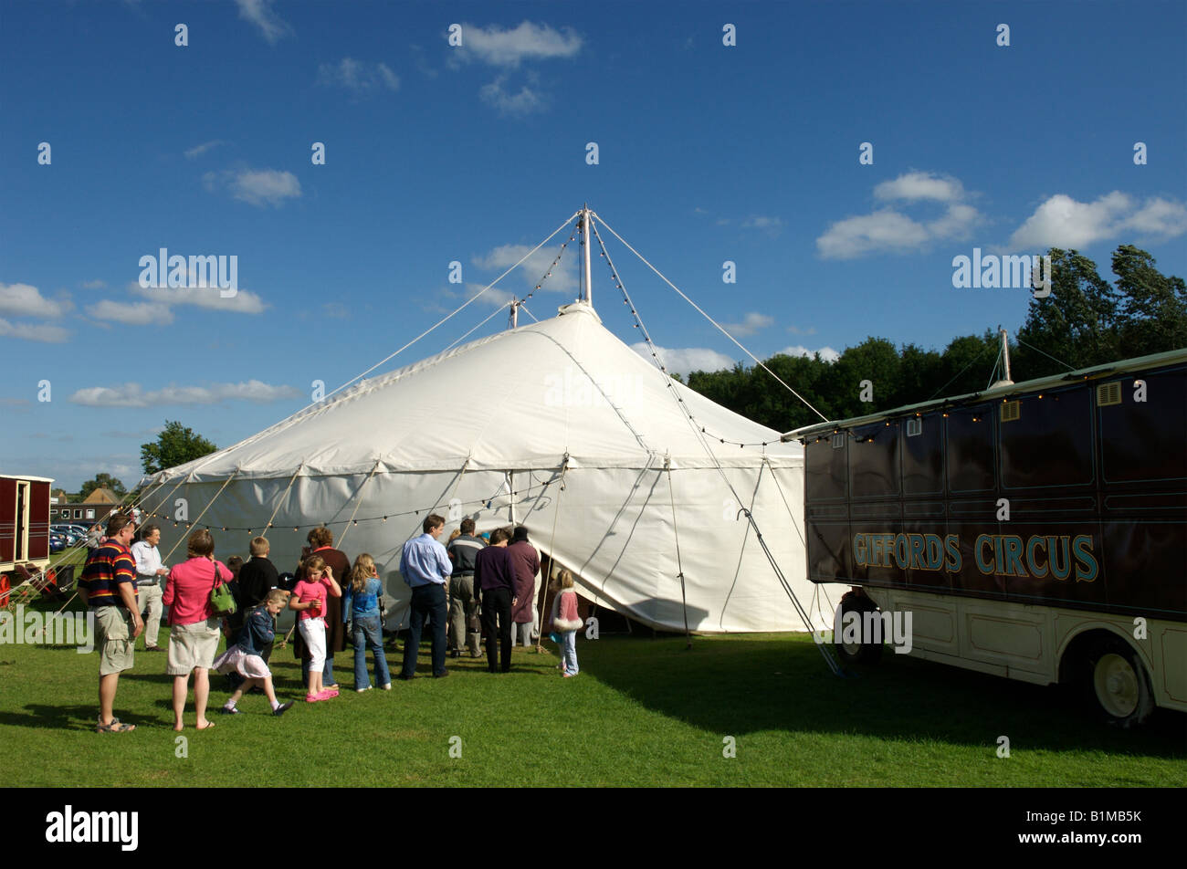 People queueing at a Circus tent Stock Photo - Alamy