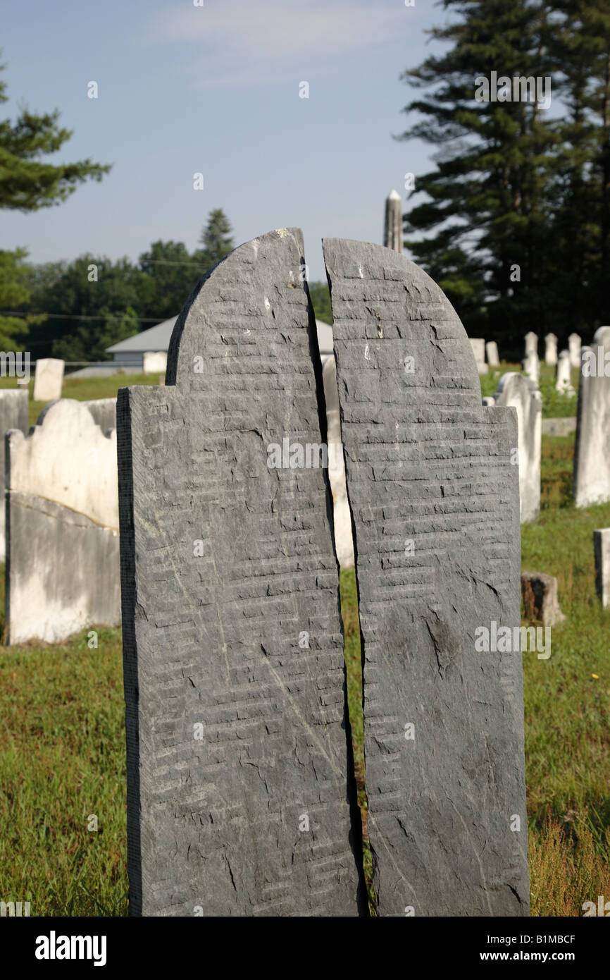 Cracked headstone in a New England graveyard Stock Photo - Alamy