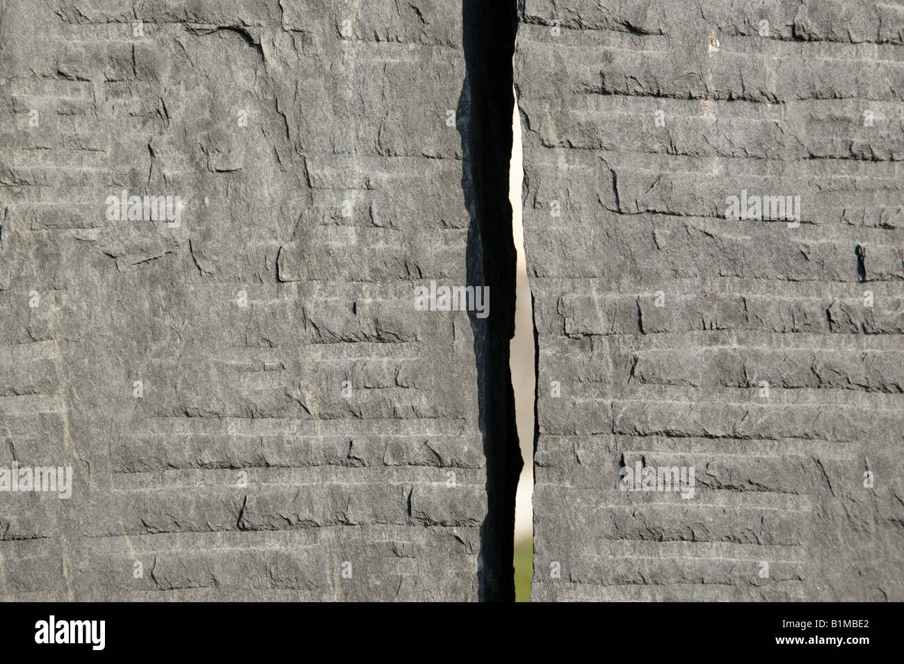 Cracked headstone in a New England graveyard Stock Photo - Alamy