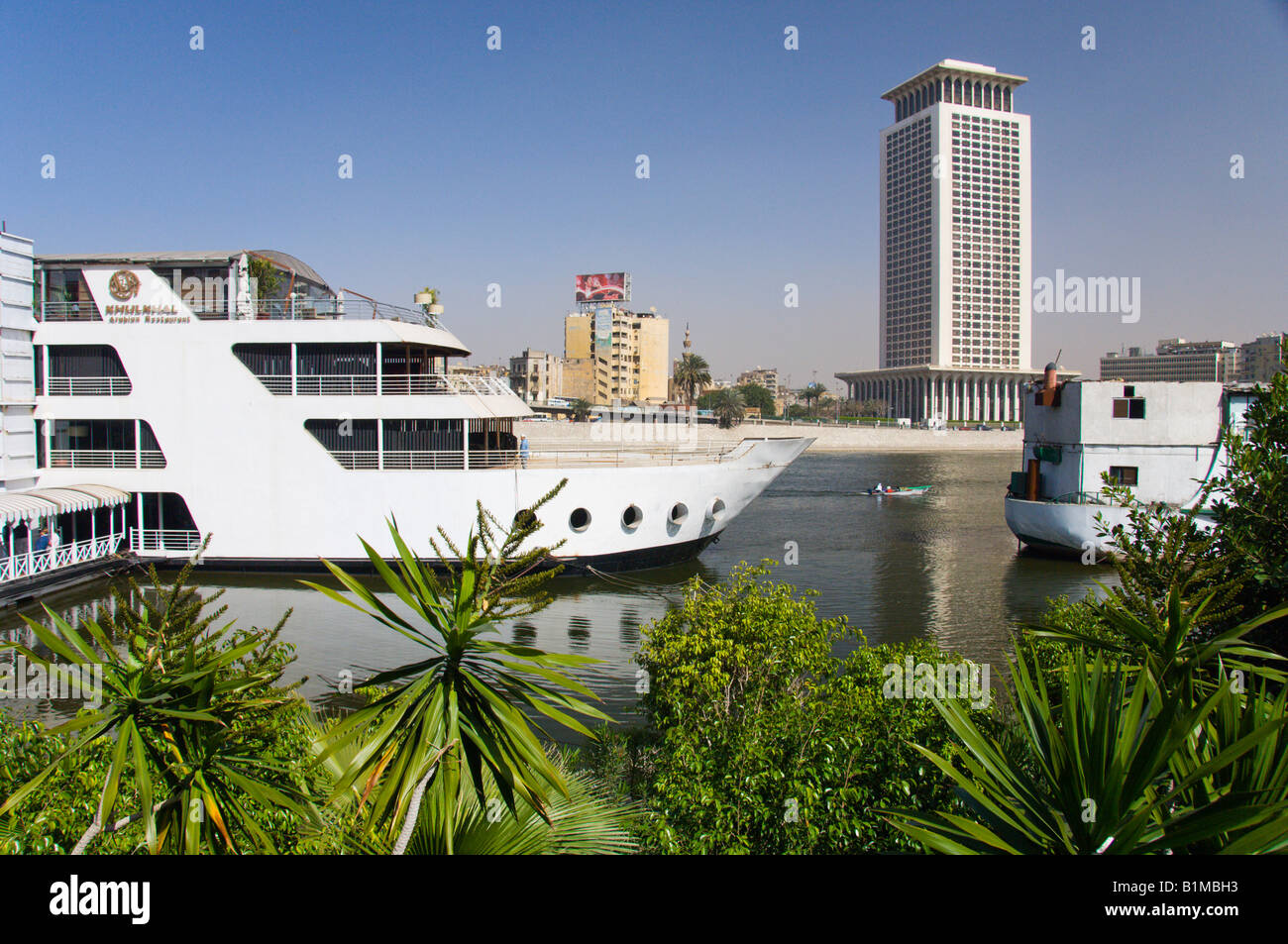 A riverboat Nile restaurant and the skyline of Cairo Egypt Stock Photo ...