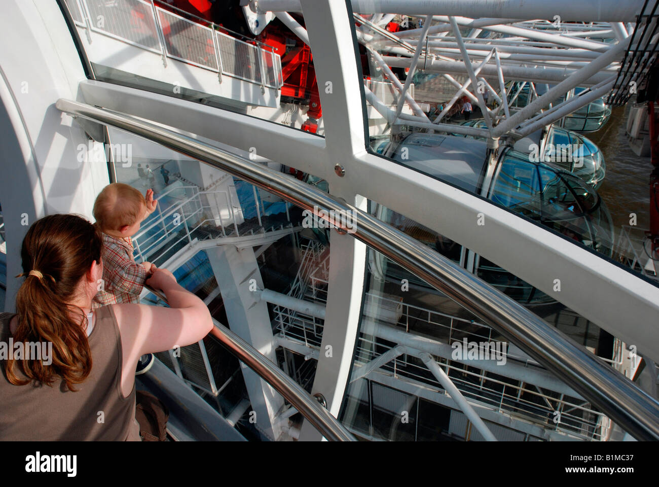 Mother supervising a child in London Eye capsule London UK Stock Photo ...