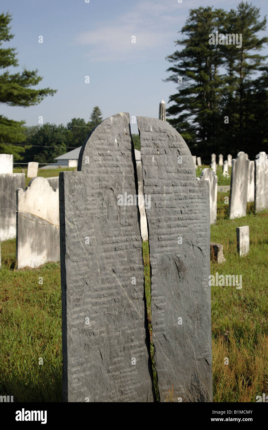 Cracked headstone in a New England graveyard Stock Photo - Alamy