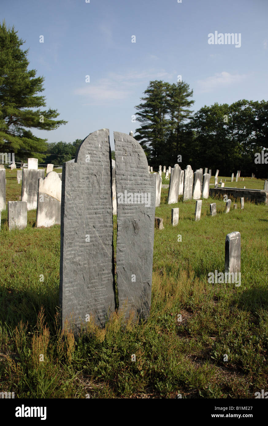 Cracked headstone in a New England graveyard Stock Photo - Alamy