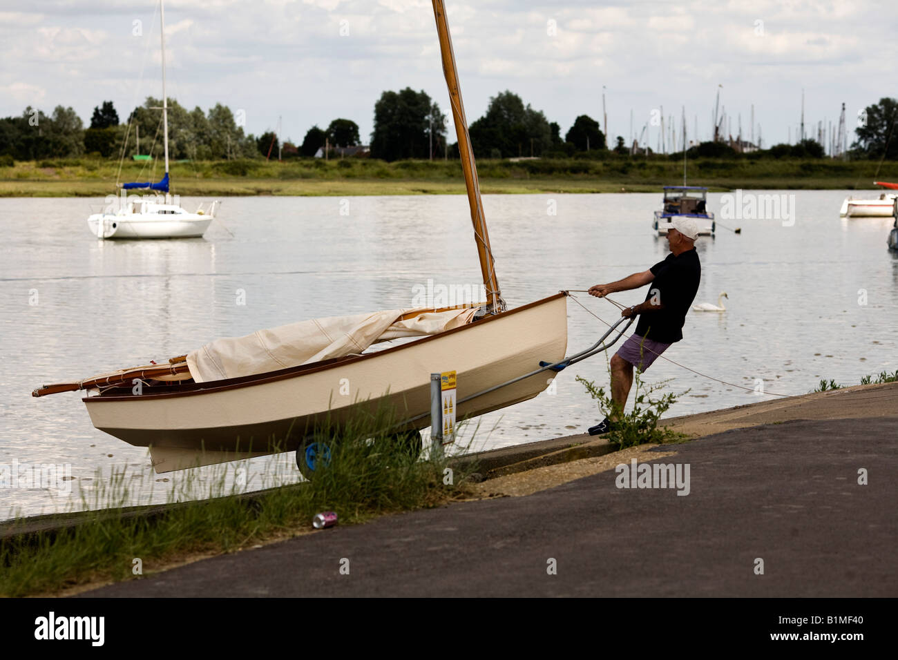sailor launching a dingy Stock Photo - Alamy
