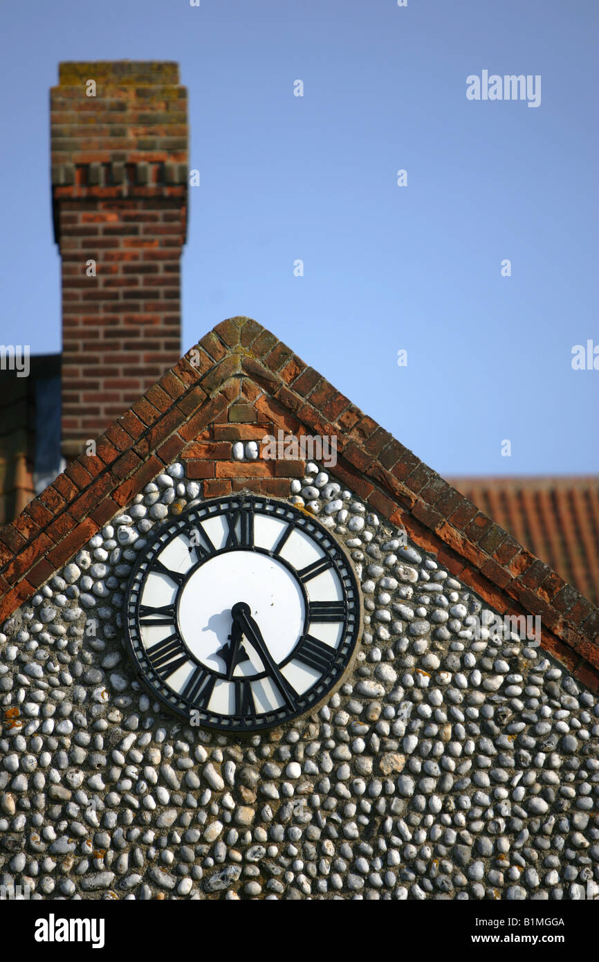 CLOCK on building wall Blakeney norfolk England Stock Photo - Alamy
