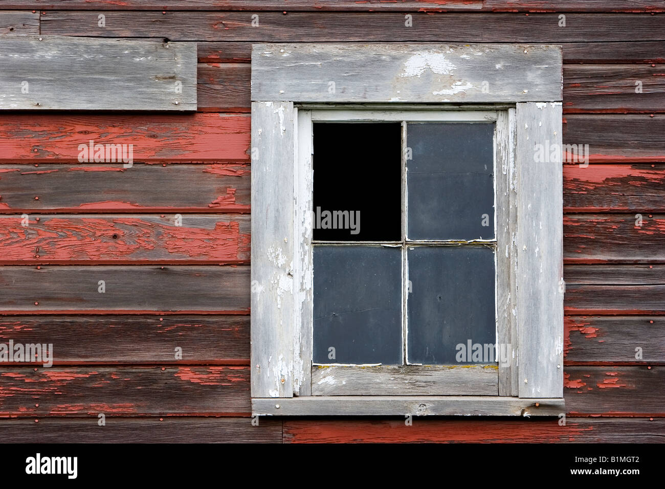 A broken window in the side of an old barn on the Old Moscow Highway in ...