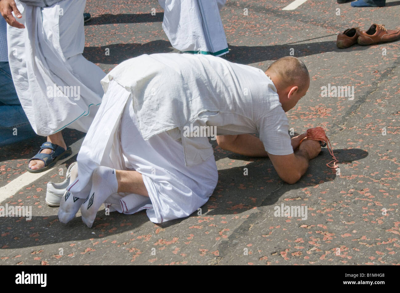 Man prostrates himself at 40th in front of deity at Hare Krishna ...