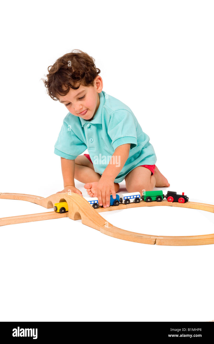 little boy playing with toy train isolated on white Stock Photo - Alamy