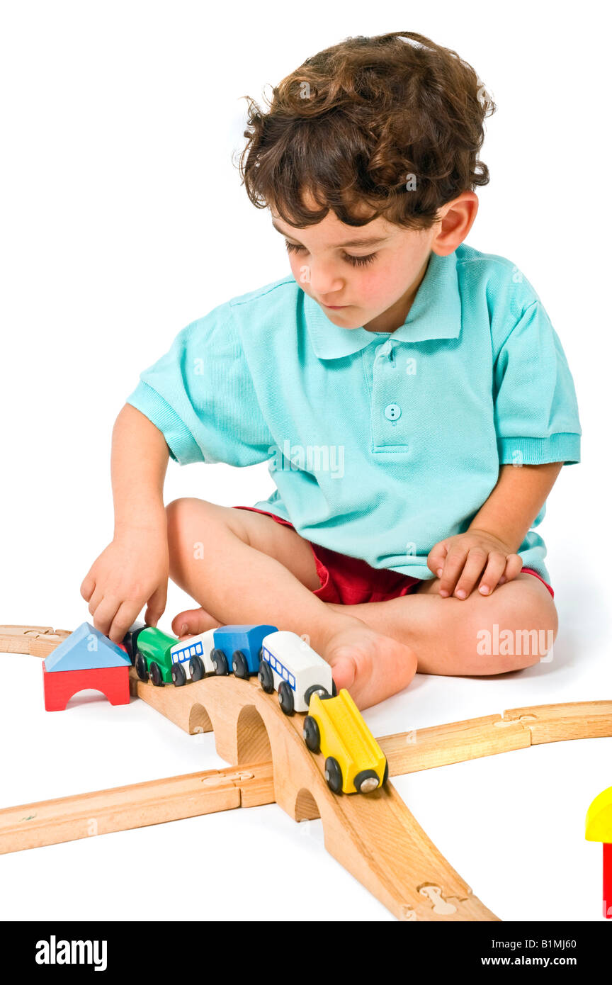 little boy playing with toy train isolated on white Stock Photo - Alamy