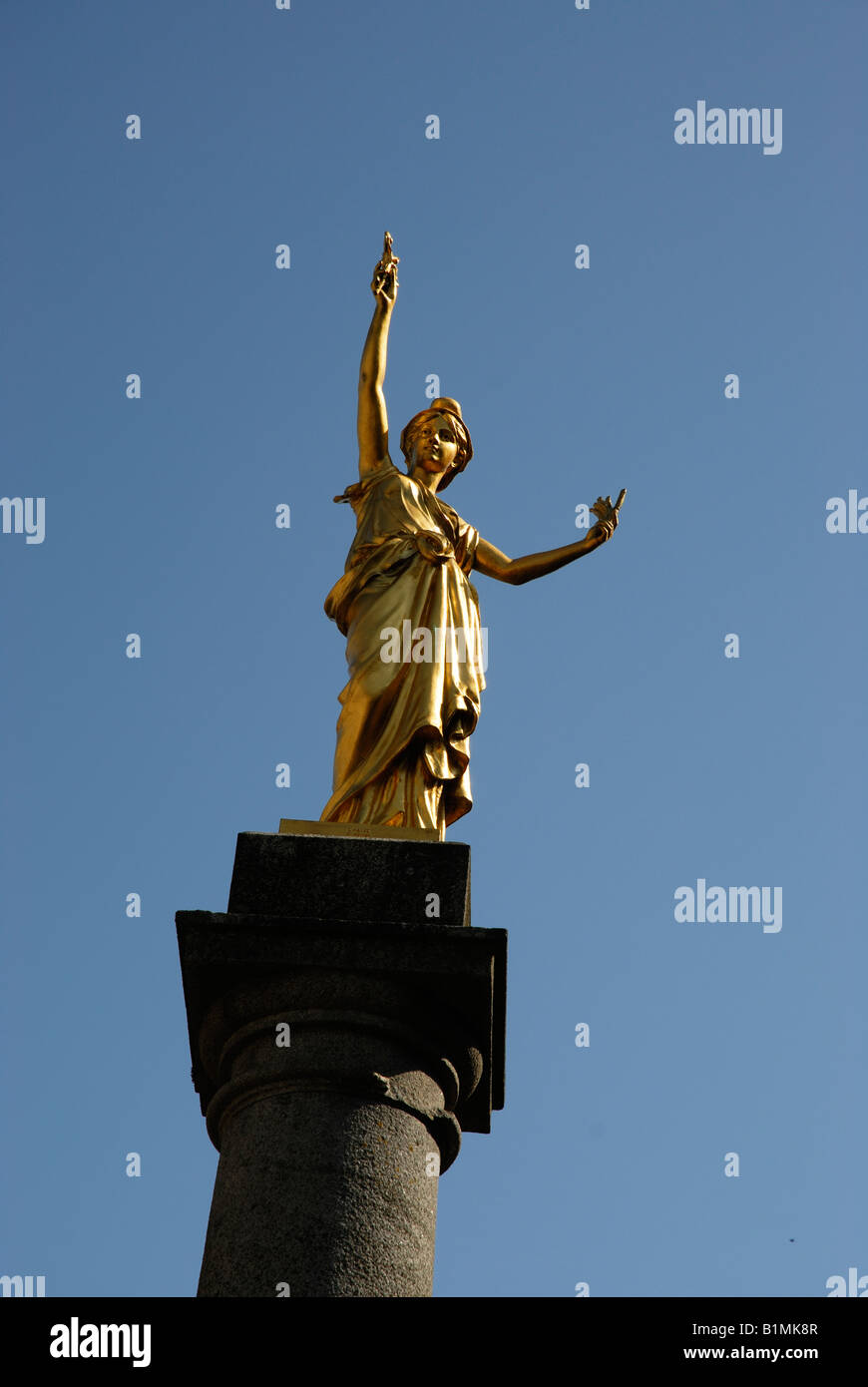 A guilded statue of Francoise, looks down from her column on the "Place ...