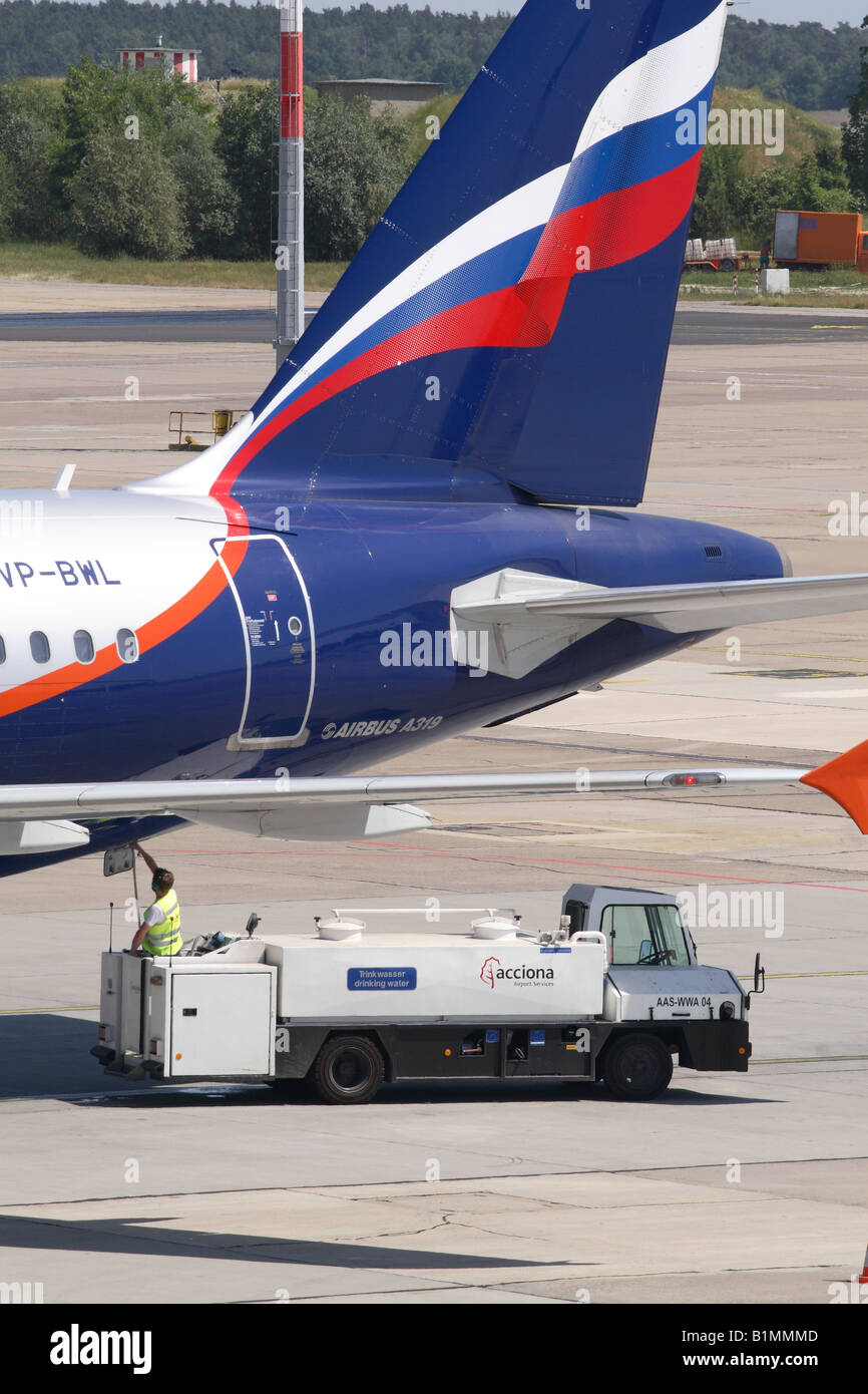 Fresh drinking water being loaded onto an Aeroflot jet arilner at ...
