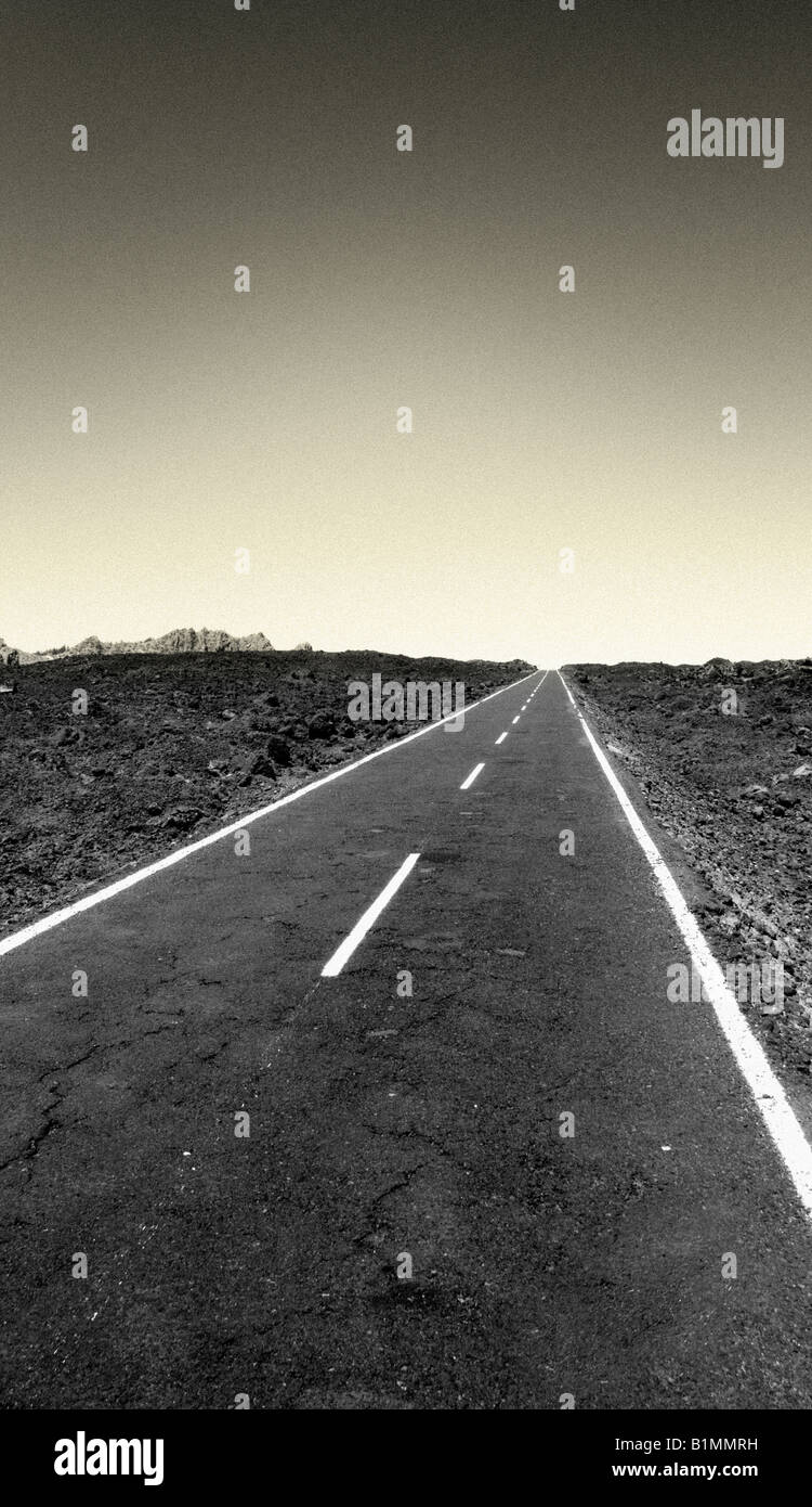a long road cutting through a volcanic desert Stock Photo - Alamy