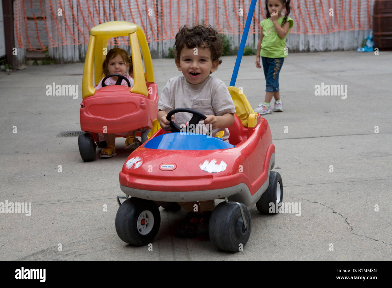 Nursery school children playing on the playground in Brooklyn New York ...