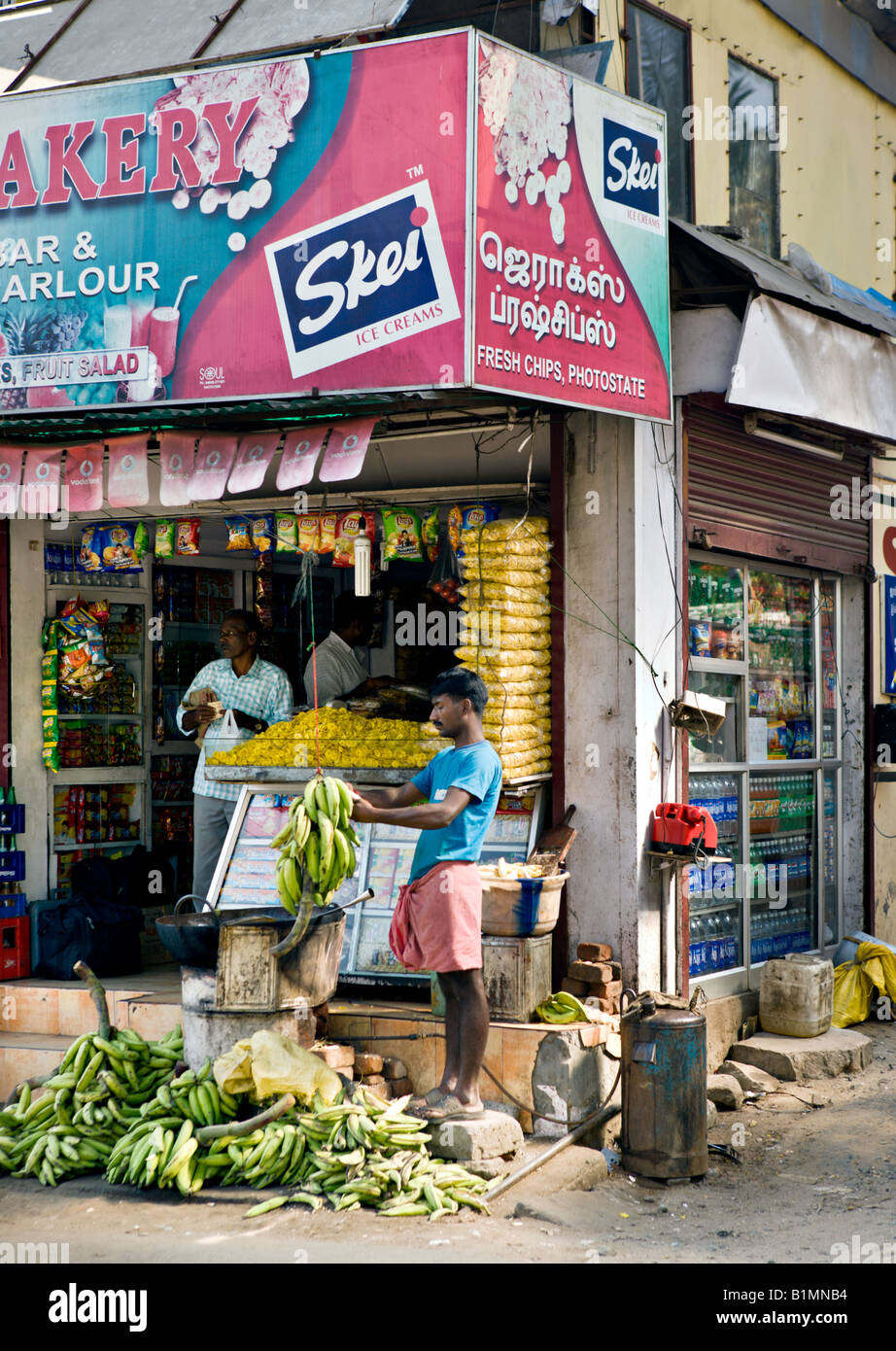 INDIA KUMILY KERALA Tiny colorful shop selling snacks and fried ...