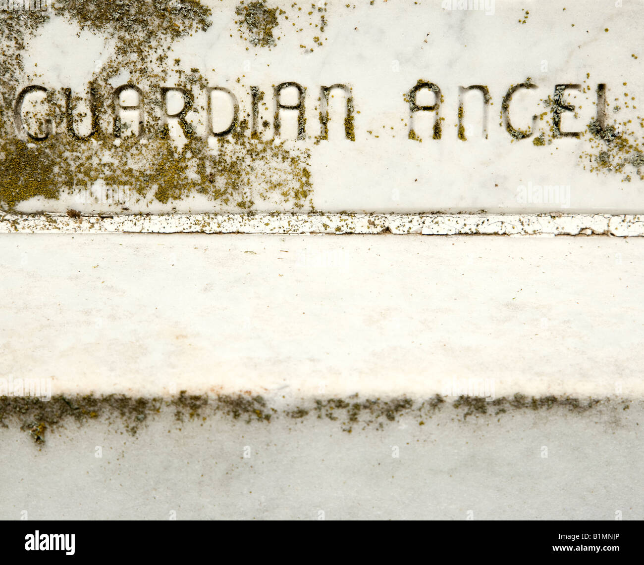 Gravestone with words Guardian Angel on it Stock Photo - Alamy