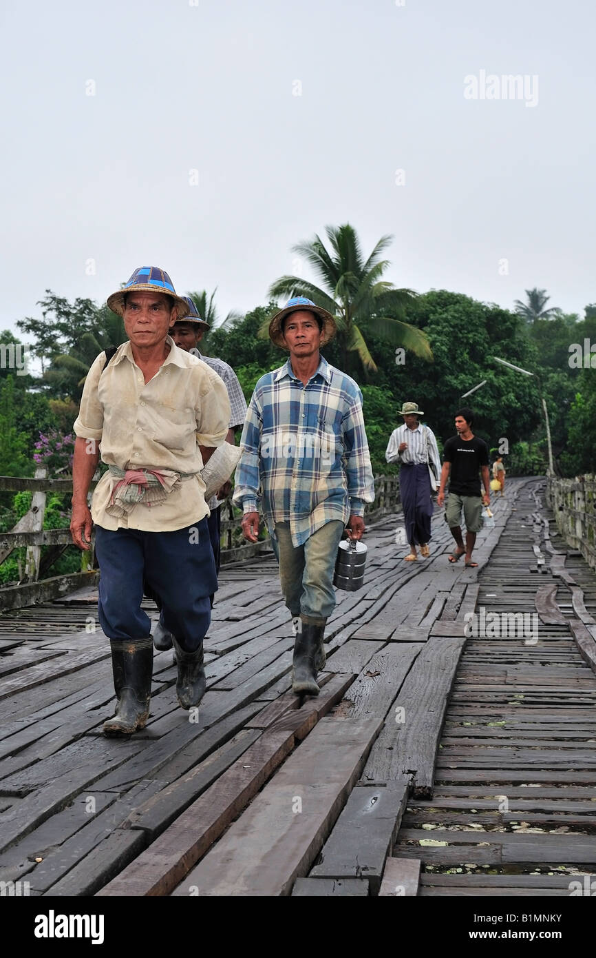 Mon tribal men on their way to work Stock Photo - Alamy