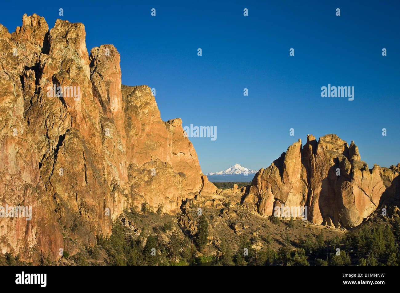 Cliffs at Smith Rock State Park in central Oregon with Mount Jefferson ...