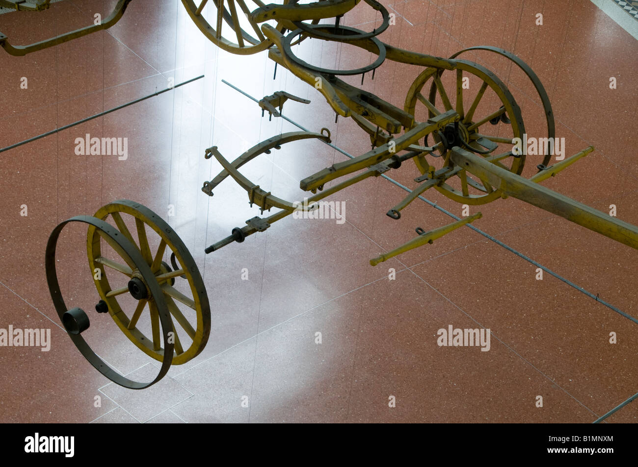 A barouche carriage stripped down and suspended on wire displayed in ...