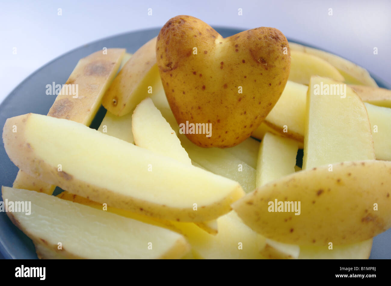 Heart shaped funny odd strange cut jacket potato hi-res stock ...