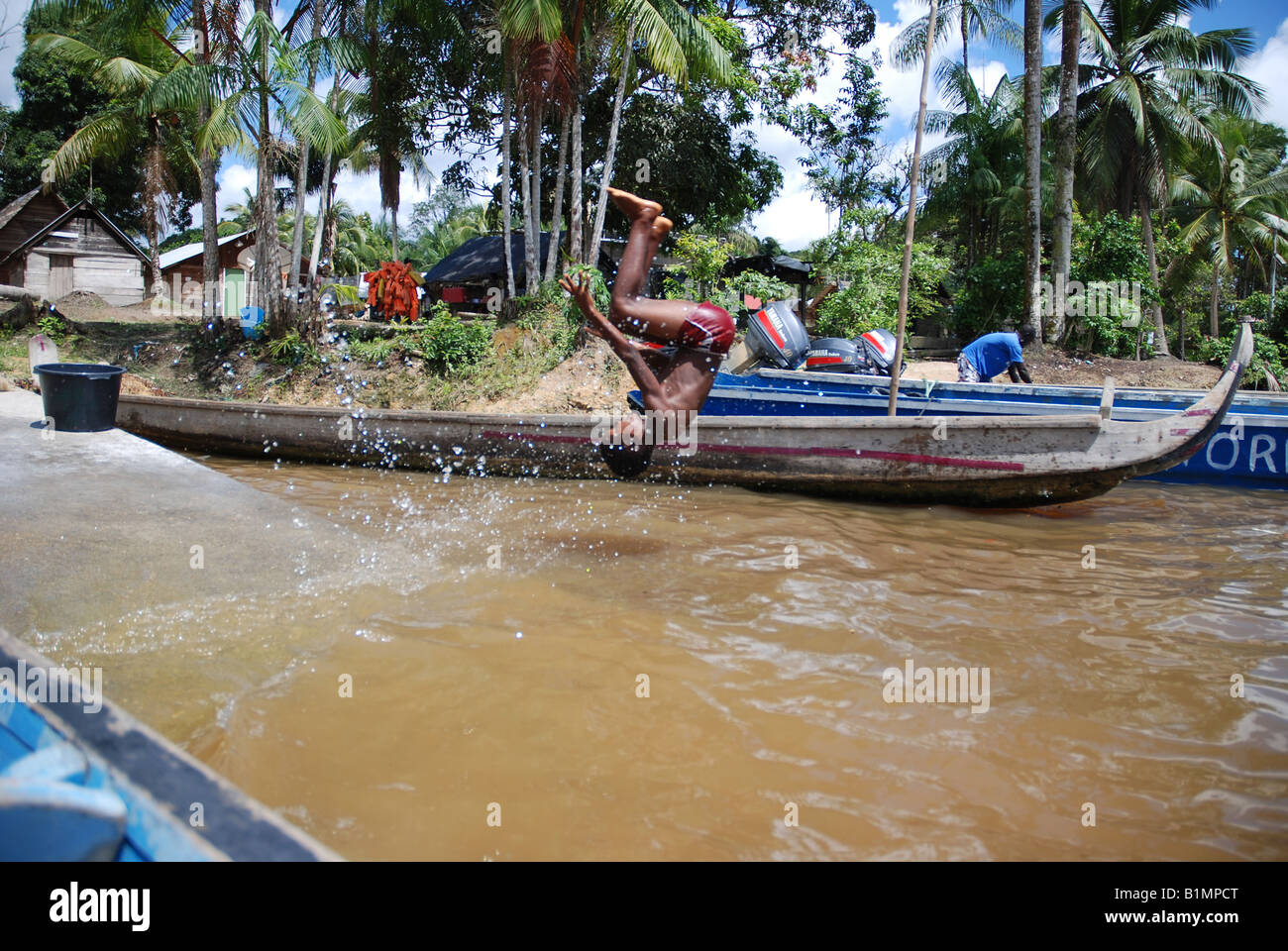 a young black boy is jumping in the Maroni river french Guyana Stock ...
