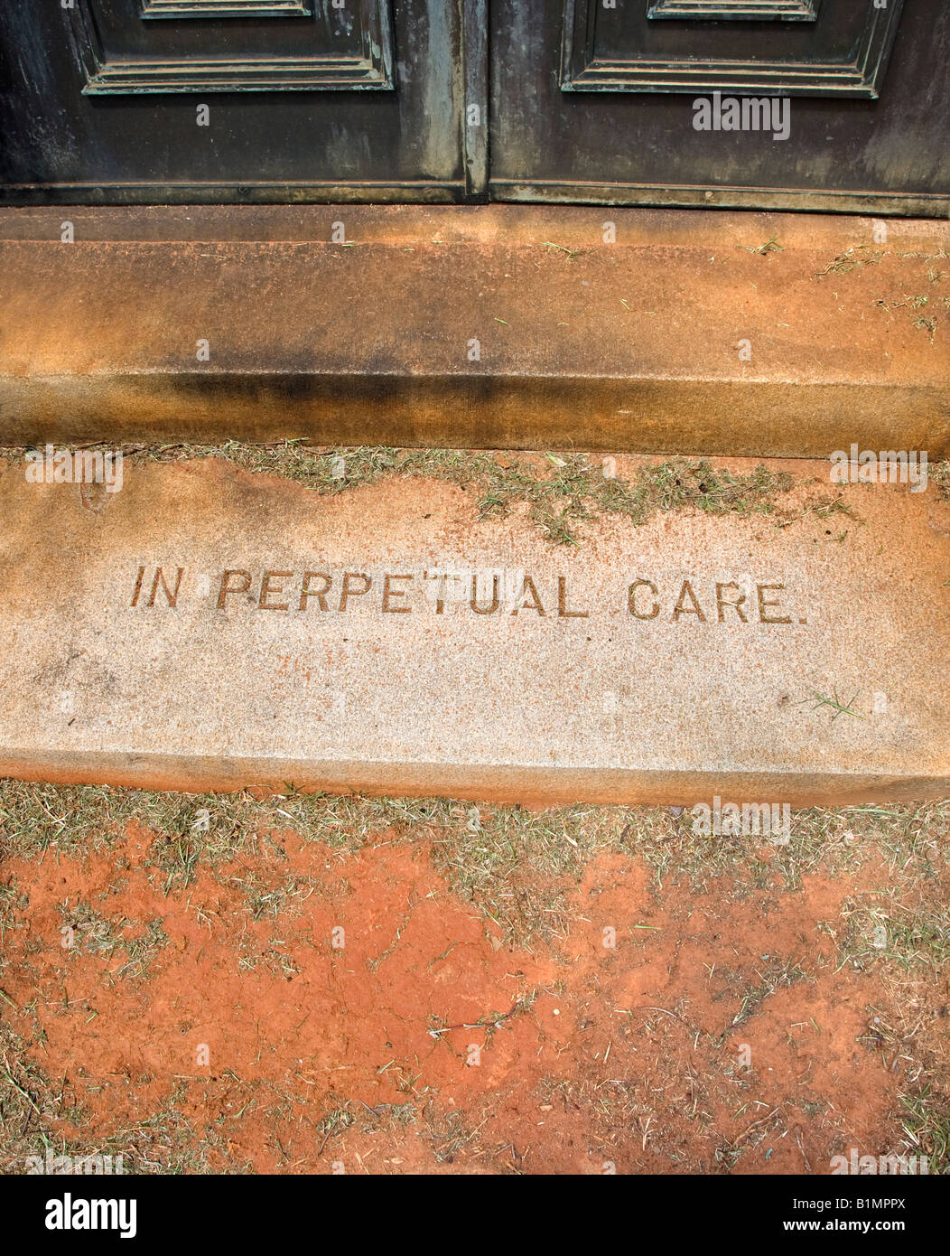 Mausoleum entrance in graveyard with words In Perpetual Care Stock ...