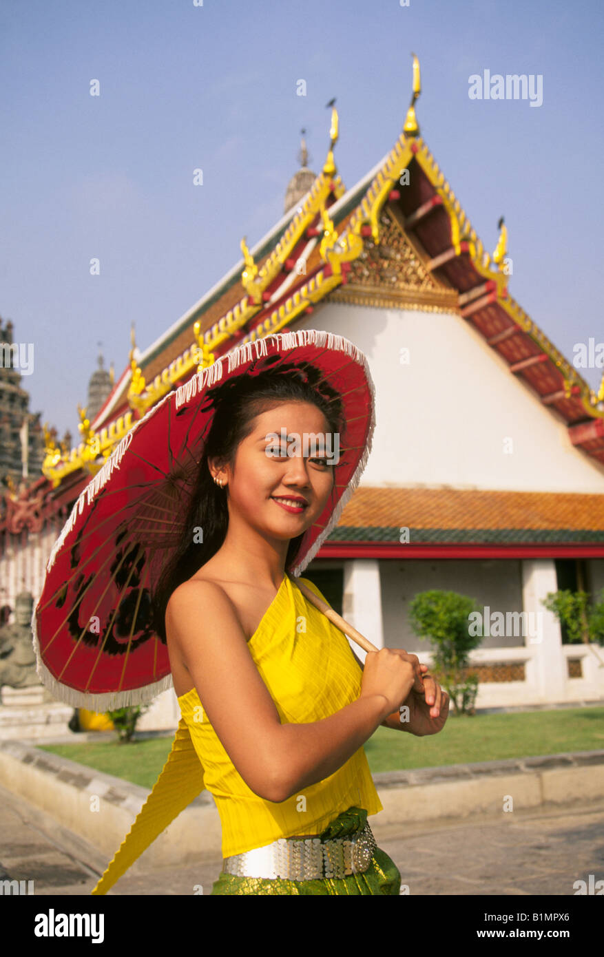 A beautiful young Thai girl wearing traditional Siamese clothing at the ...