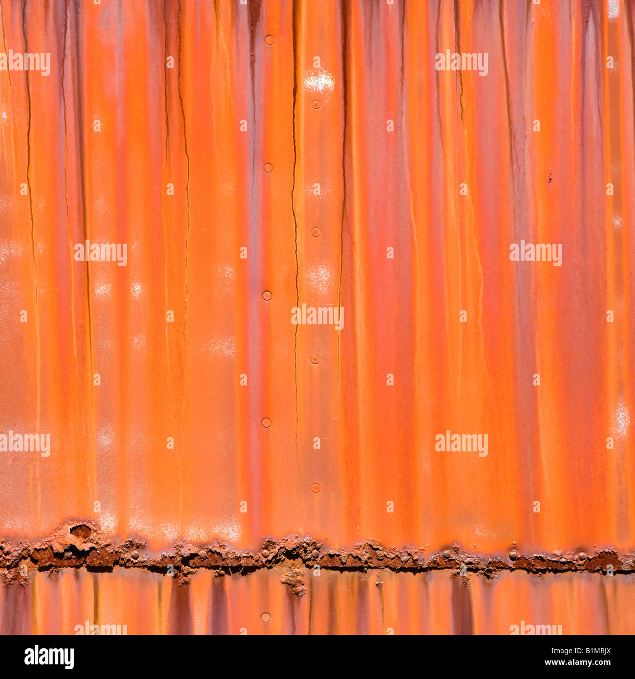 Closeup of metal orange siding Stock Photo - Alamy