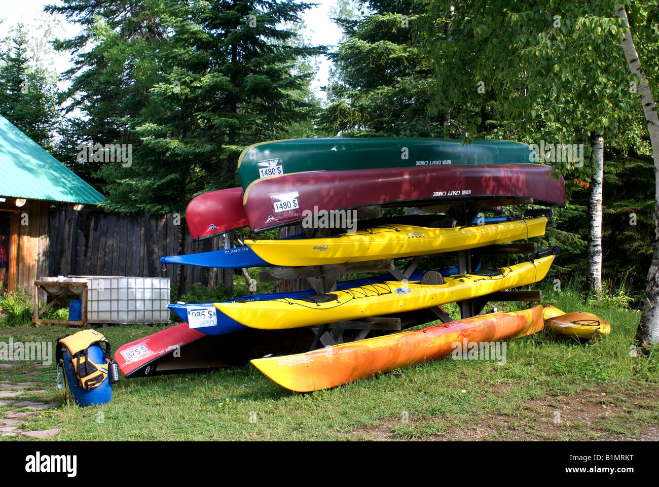 canoes kayaks stacked by Bonaventure River Quebec Stock Photo - Alamy