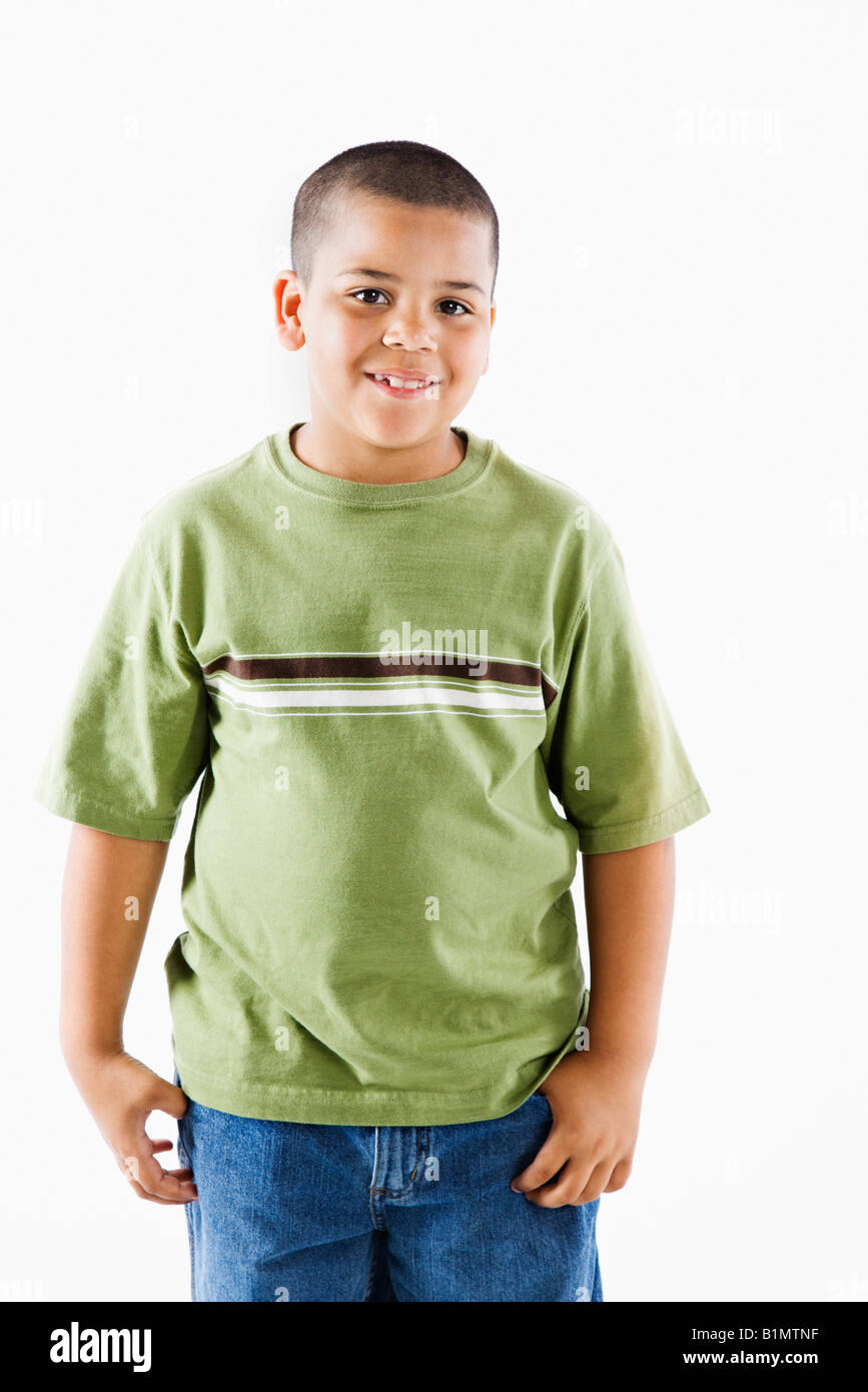 Young latino adolescent boy standing smiling Stock Photo - Alamy